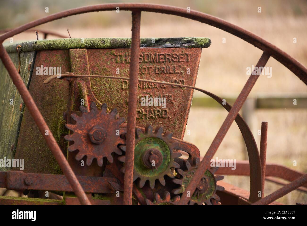 Old farming machinery in field, Somerset Root Seed Drill Stock Photo ...