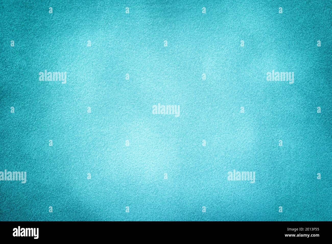 Light blue matte background of suede fabric with vignette, closeup ...