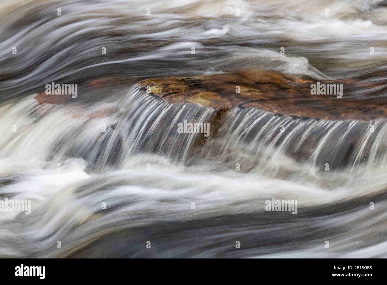 Water flowing over rocks in the Corrieshalloch Gorge, Ullapool ...