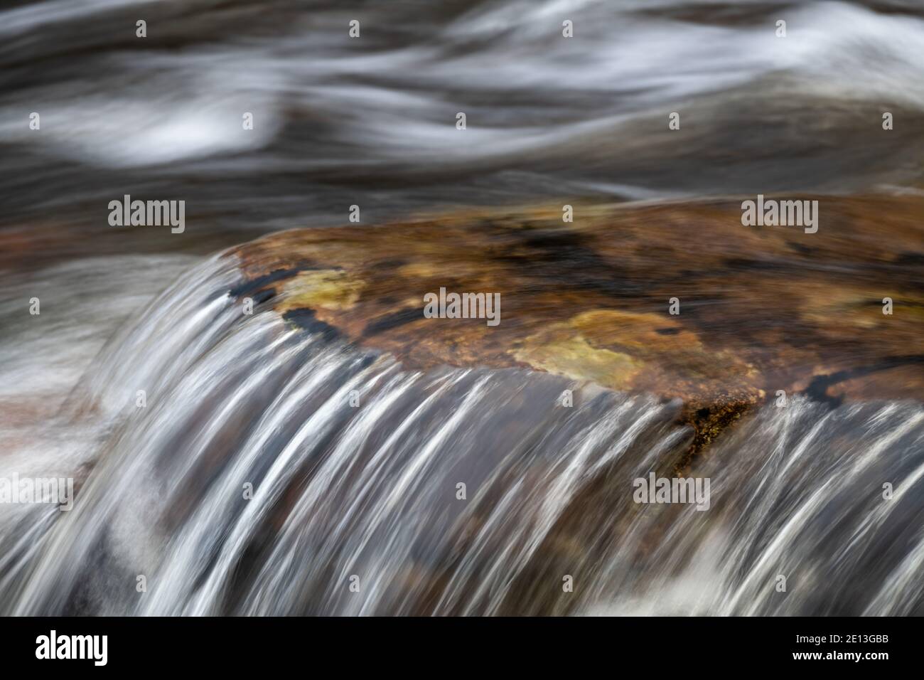 Water flowing over rocks in the Corrieshalloch Gorge, Ullapool ...