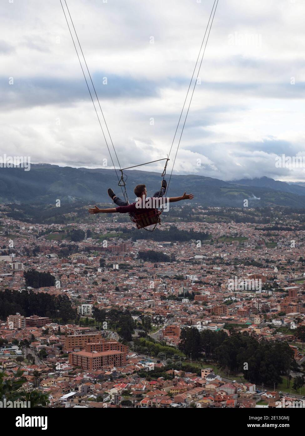 Tourist adventurer on panorama swing Columpio extreme sports adrenaline ...