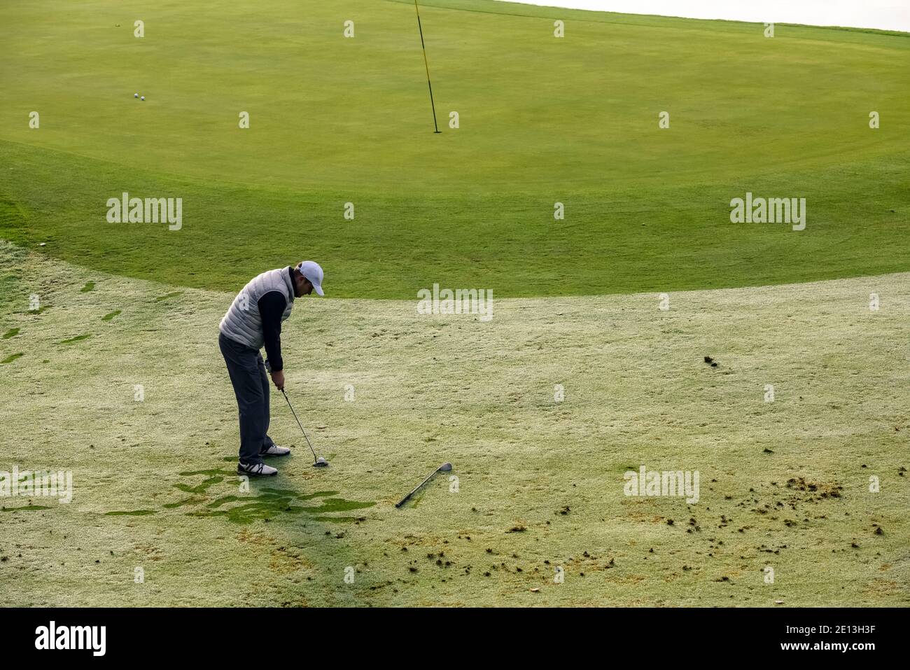 With a putt, hit the hole with the golf ball Stock Photo - Alamy