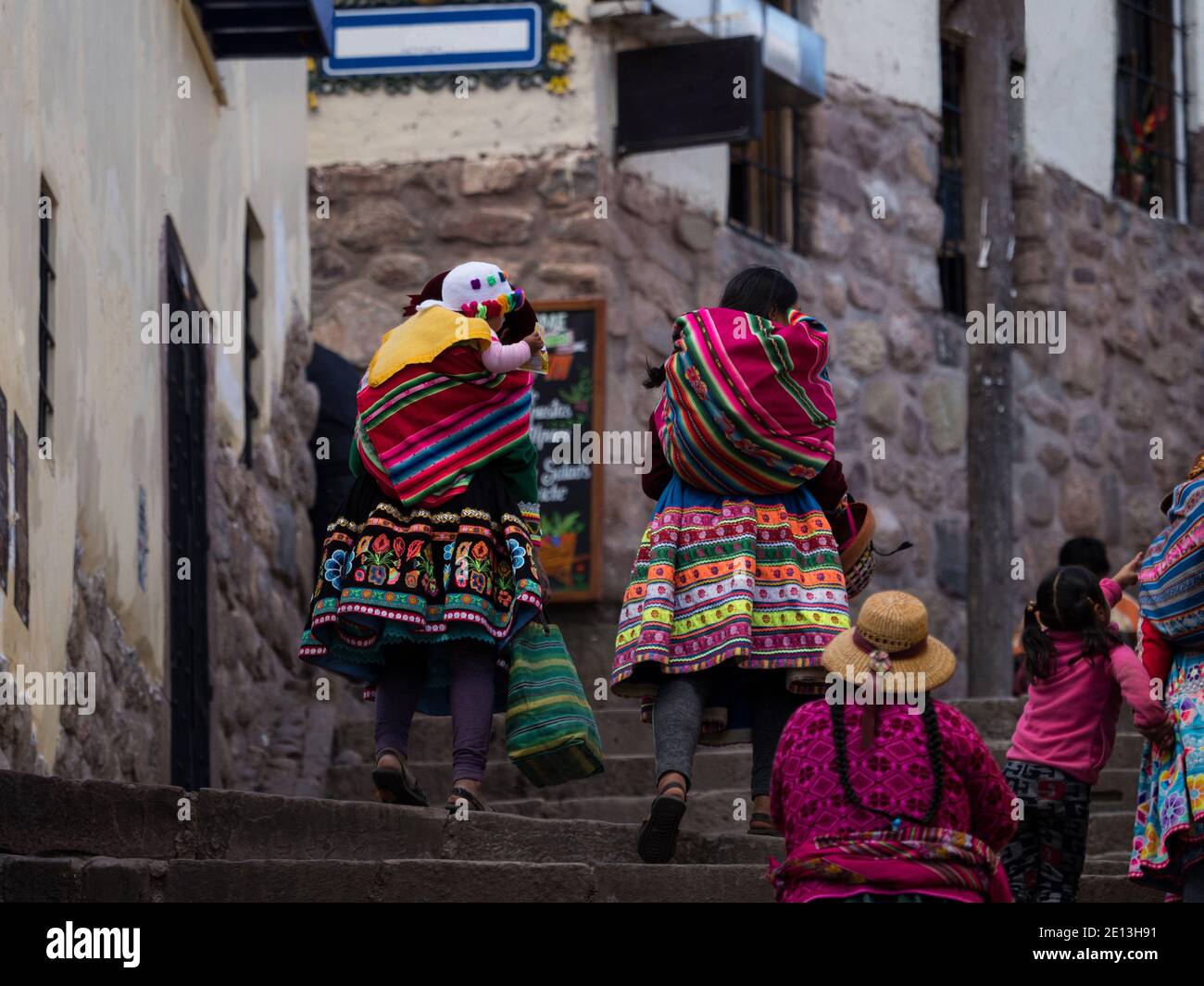Indigenous quechua people women family in traditional colorful ...