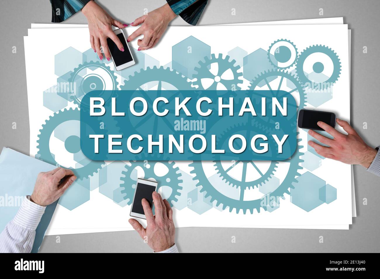 Blockchain technology concept placed on a desk with hands using ...