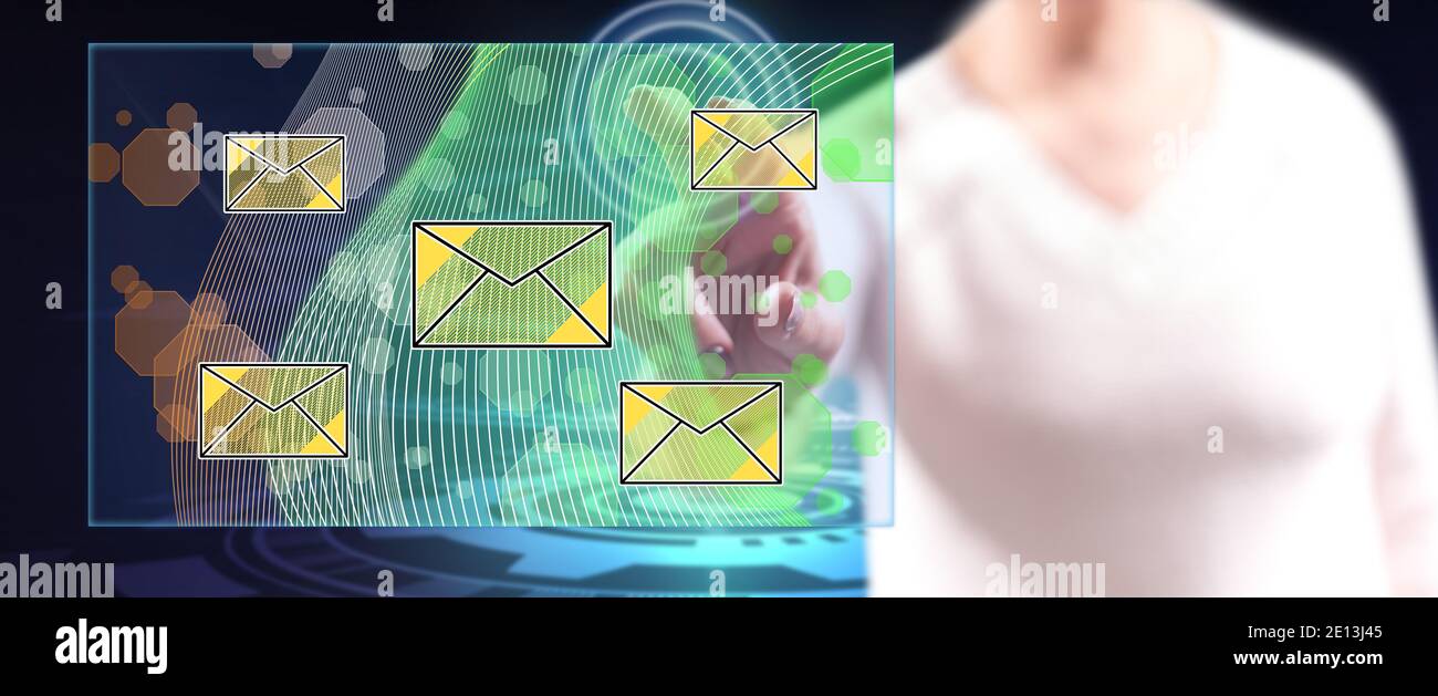 Woman touching an email concept on a touch screen with her fingers ...
