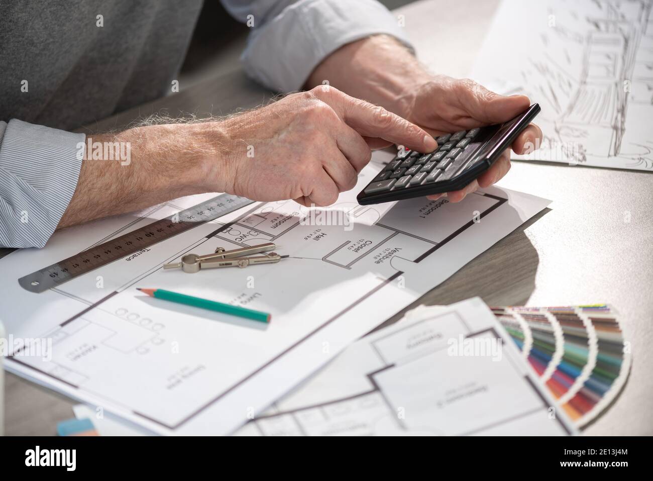 Architect calculator using plan project hi-res stock photography and ...