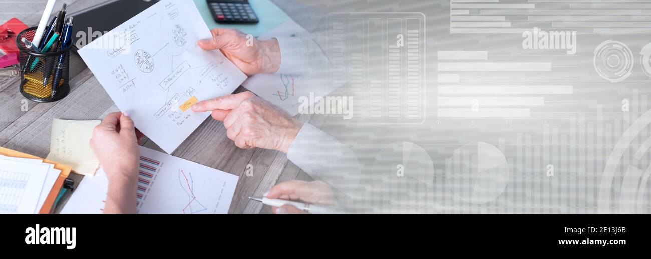 Two business people working together in office; panoramic banner Stock ...