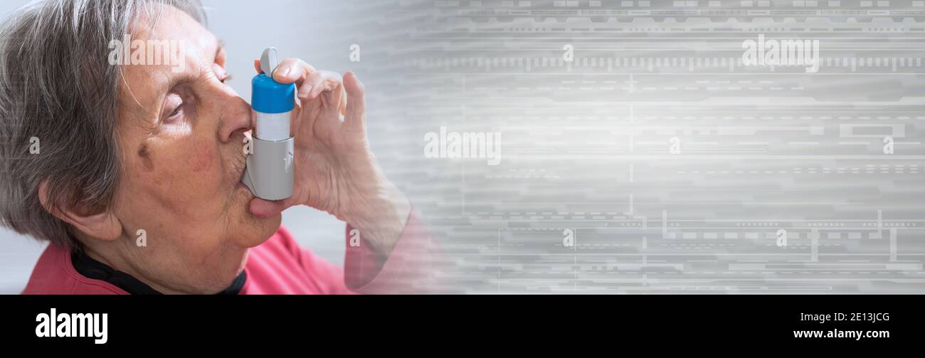 Senior woman using an asthma inhaler; panoramic banner Stock Photo - Alamy