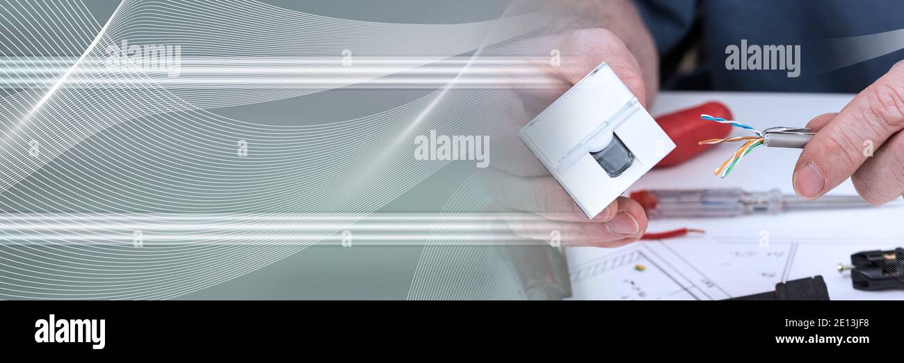 Hand holding an ethernet outlet and a cable; panoramic banner Stock ...