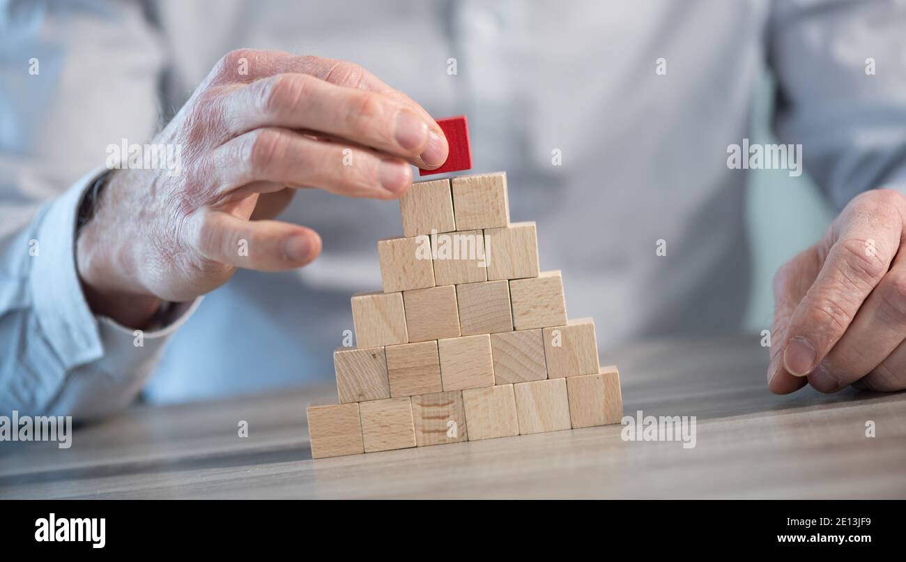 Leader at top of pyramid hi-res stock photography and images - Alamy