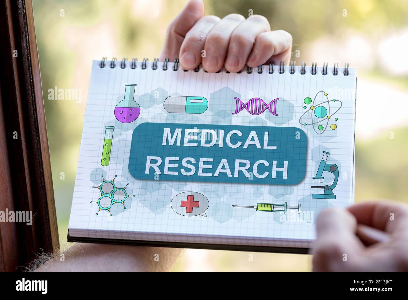 Hand drawing medical research concept on a notepad Stock Photo - Alamy