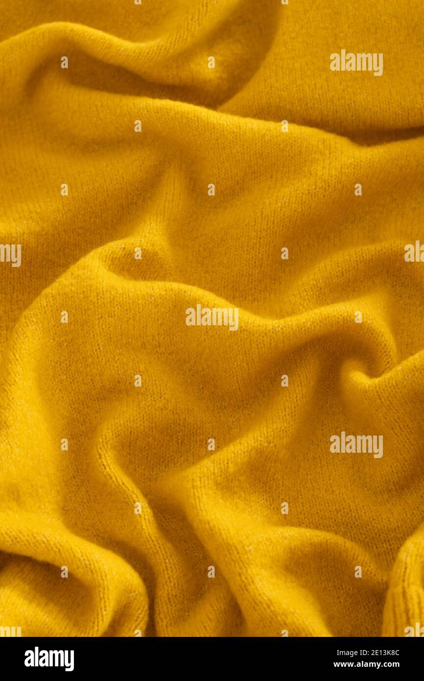 Yellow woolen cloth, soft cozy fabric in trendy color Stock Photo - Alamy