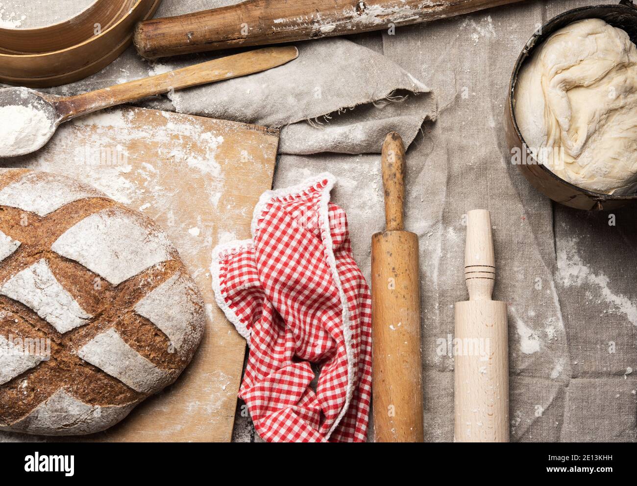 bread, kneaded dough of white wheat flour lies on a metal bucket and a ...