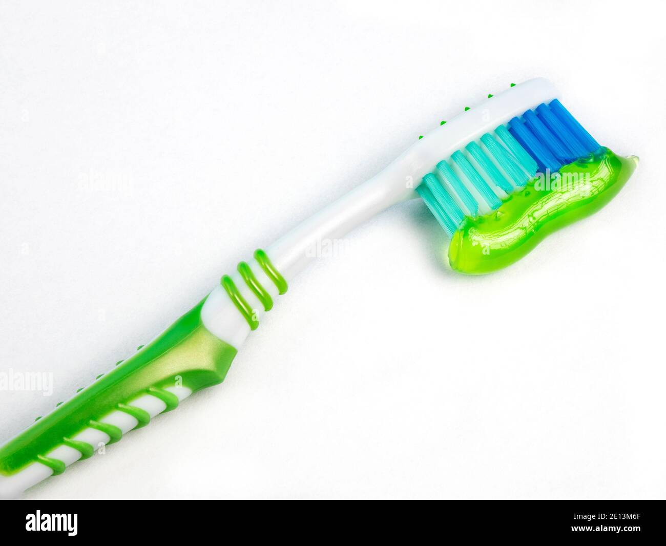 Toothbrush and toothpaste on white background Stock Photo - Alamy