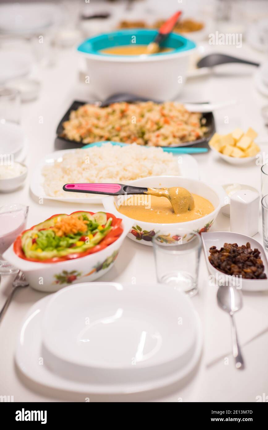 Beautiful ready lunch on dining table in modern home Stock Photo - Alamy