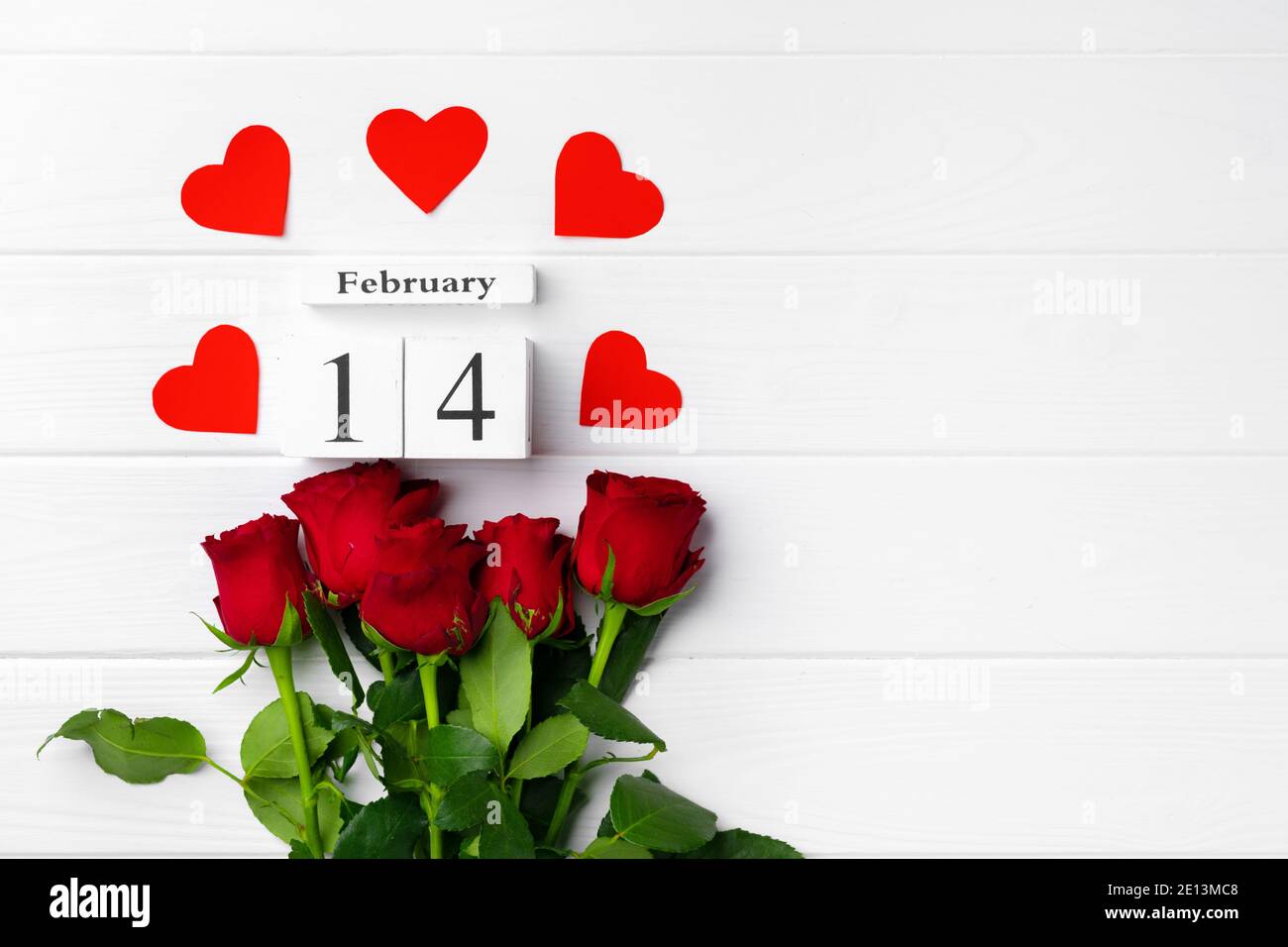Wooden calendar 14th February and roses on white background Stock Photo ...