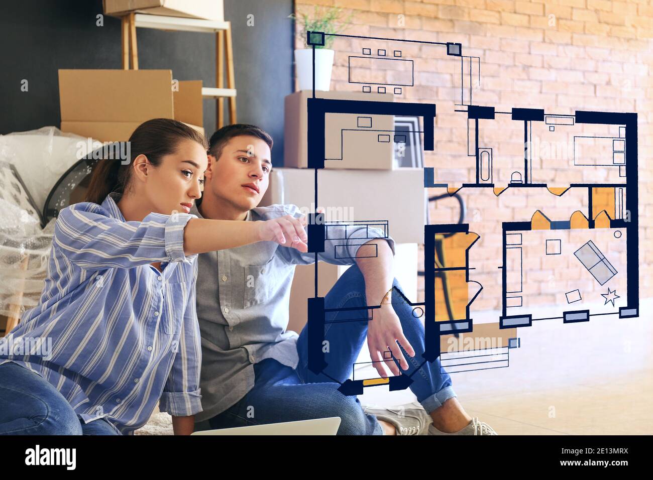 Young couple planning design of their new house Stock Photo - Alamy