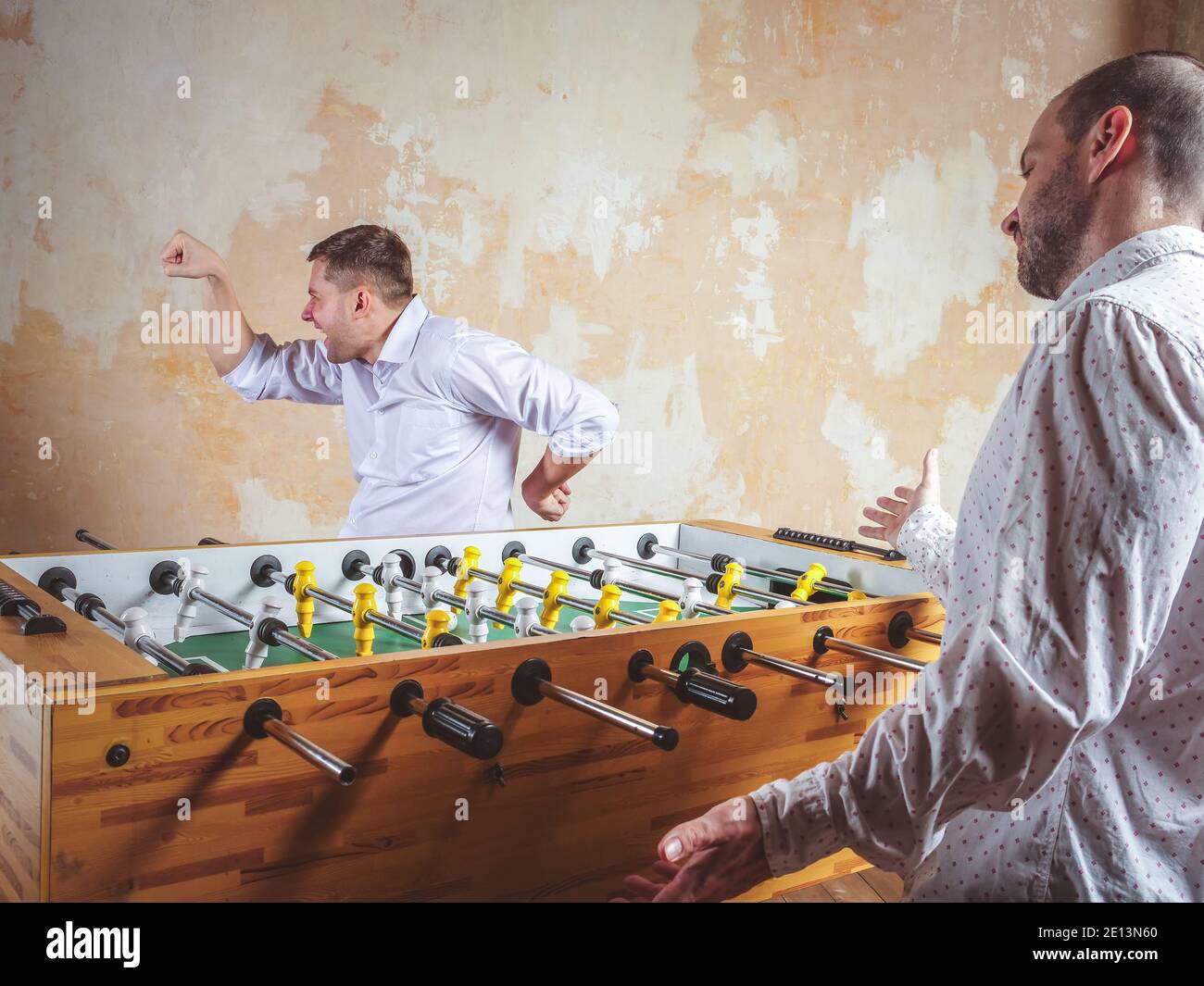 Playing table football in office hi-res stock photography and images ...