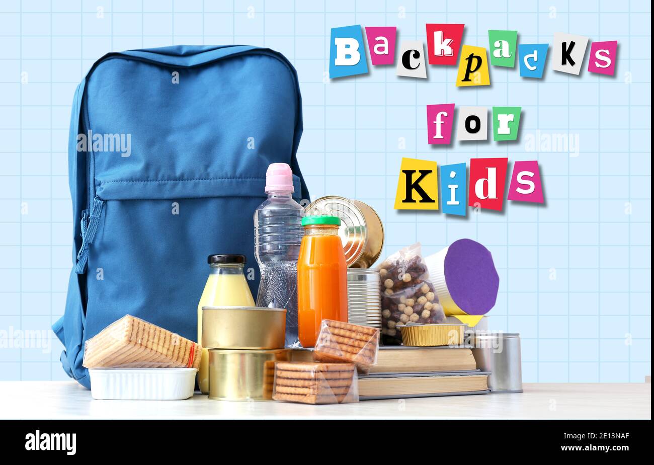 Schoolbag with different products on table. Concept of Backpack Food ...