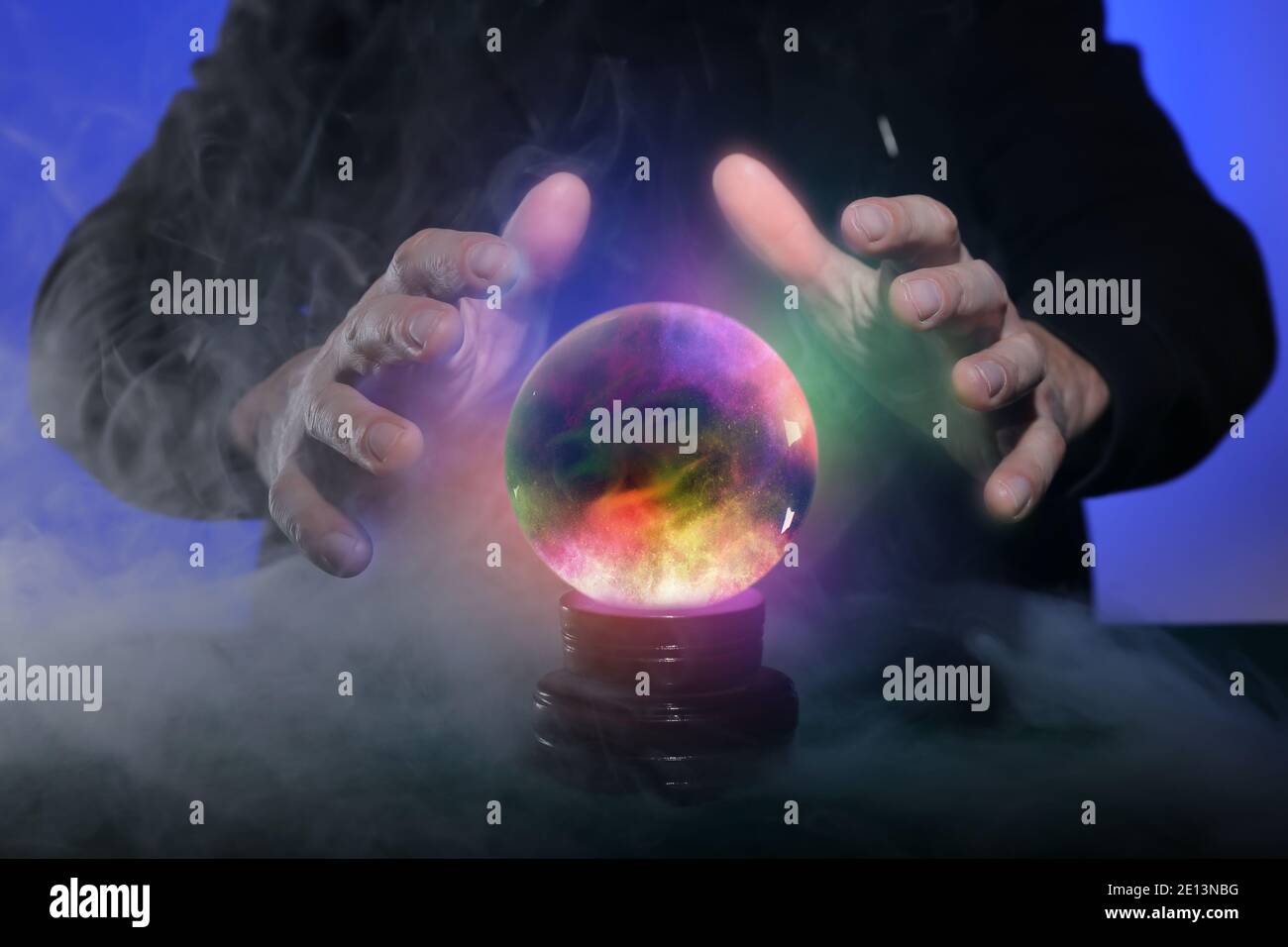 Fortune teller with crystal ball on color background, closeup Stock ...