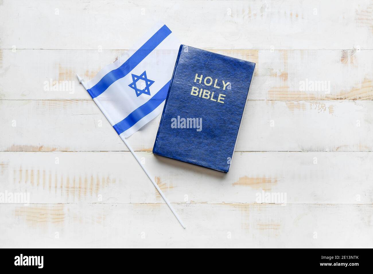 Holy Bible and flag of Israel on light background Stock Photo - Alamy