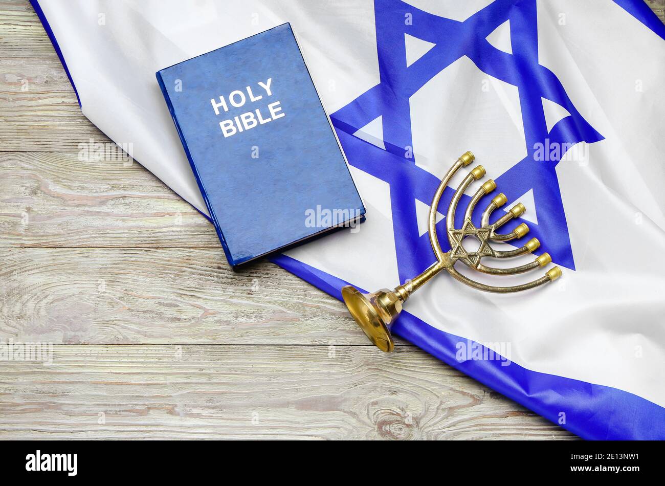 Flag of Israel, Holy Bible and menorah on wooden background Stock Photo ...