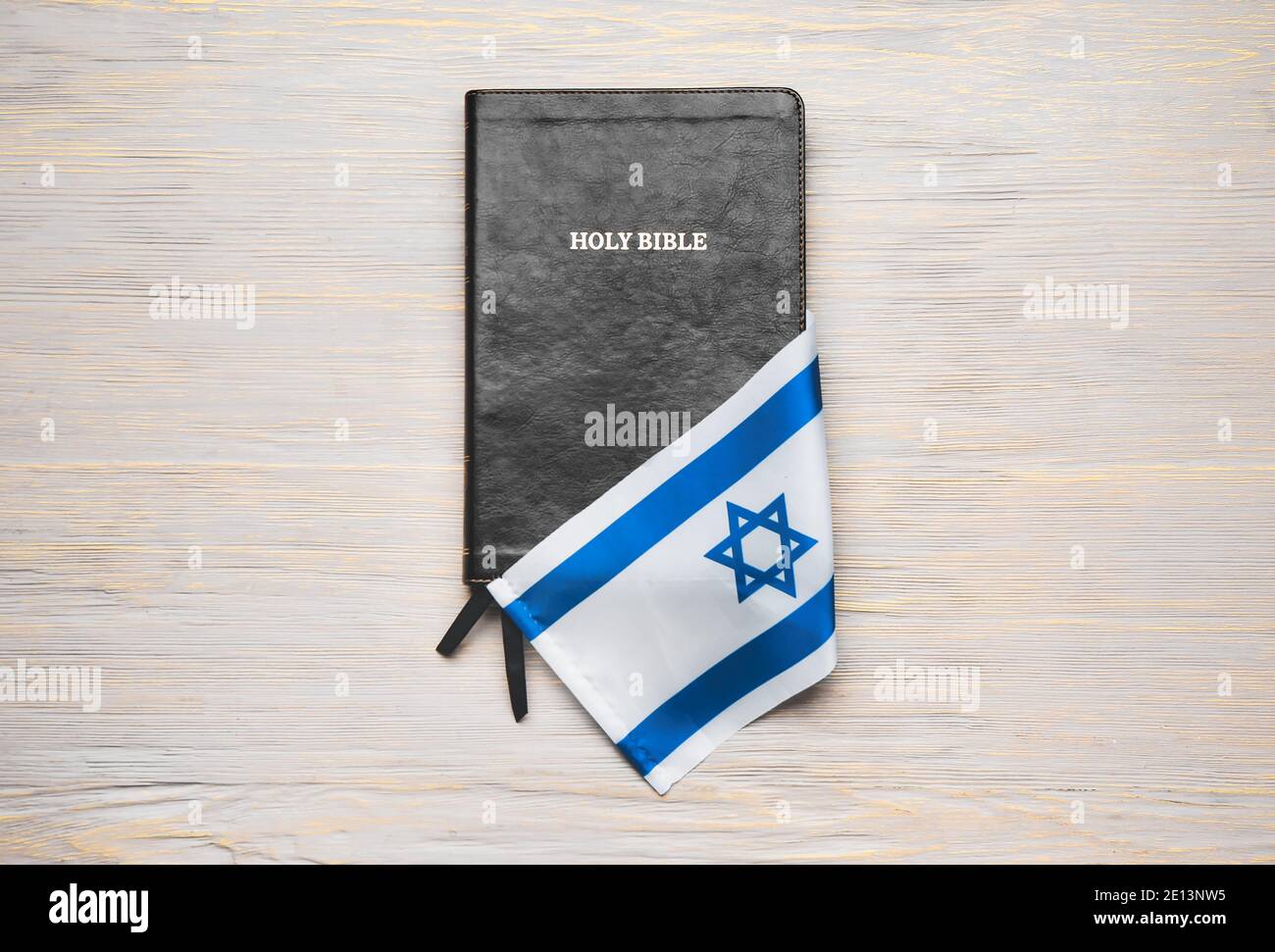 Holy Bible and flag of Israel on light background Stock Photo - Alamy