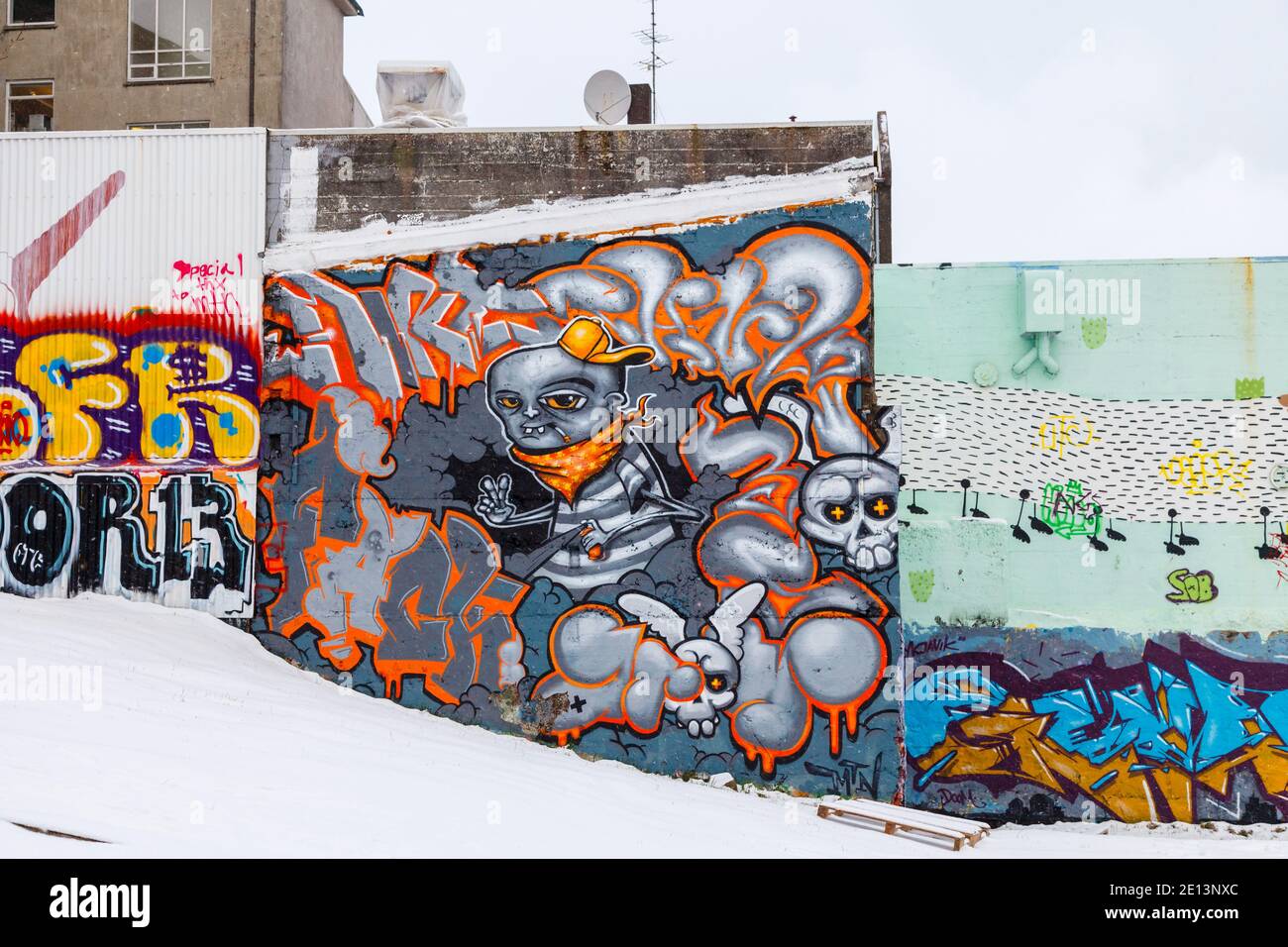 Colourful graffiti spray painted on walls in a run-down area of ...