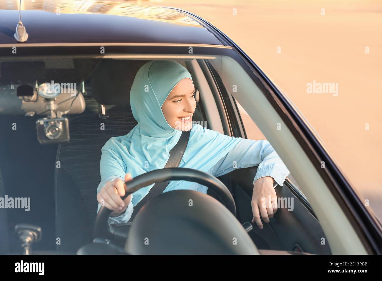 Young Muslim woman in modern car Stock Photo - Alamy