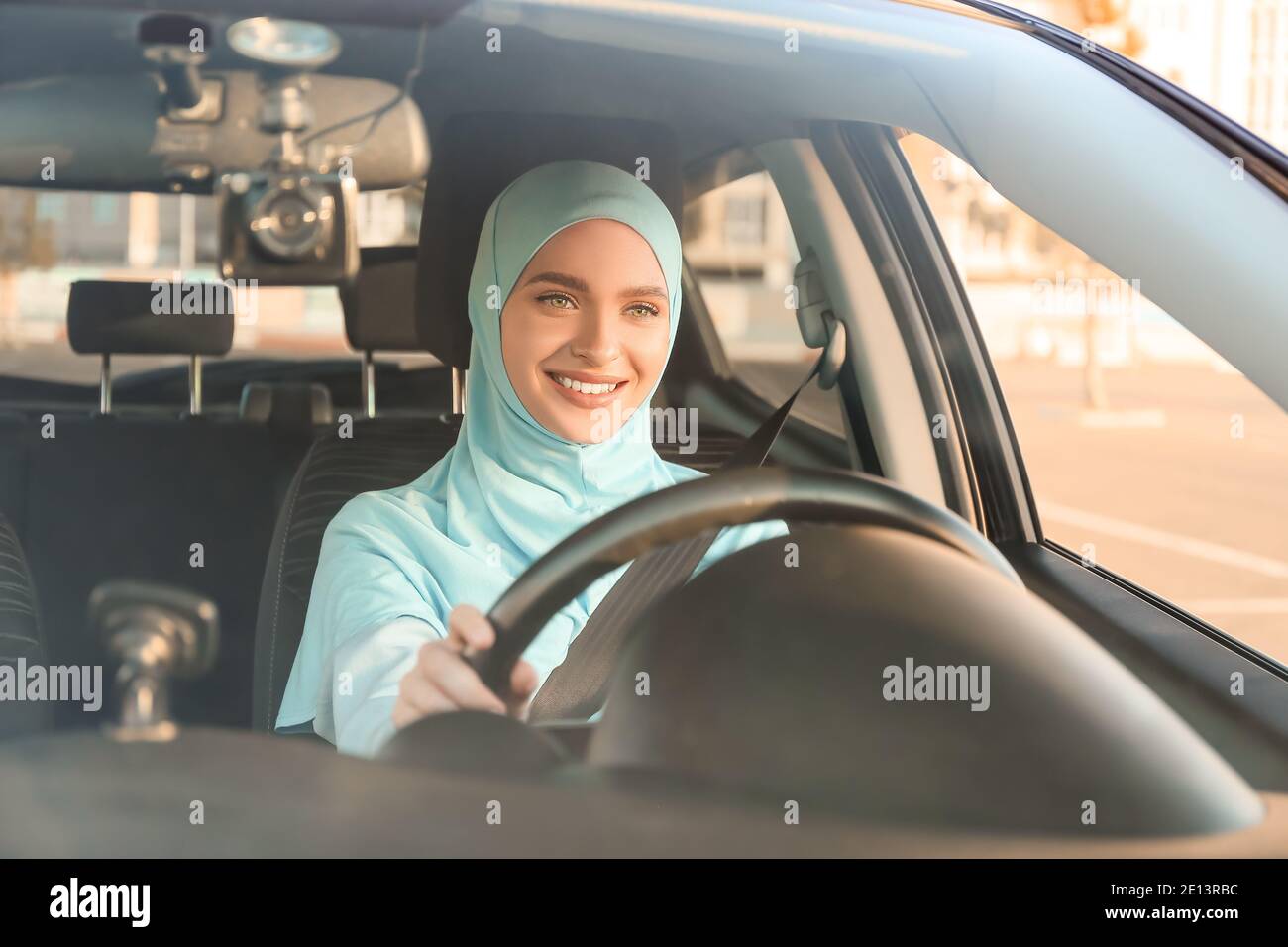 Young Muslim woman in modern car Stock Photo - Alamy