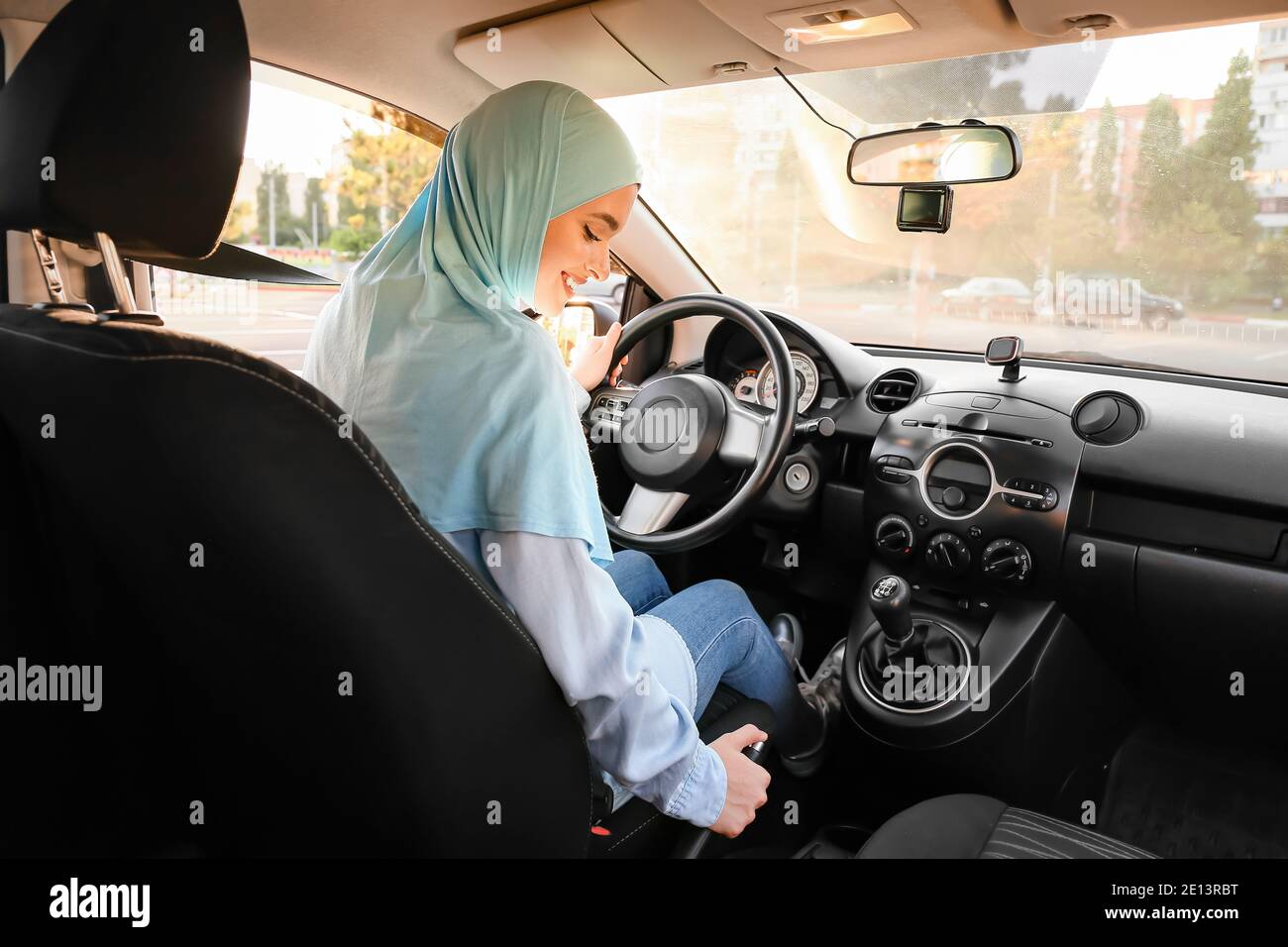 Young Muslim woman in modern car Stock Photo - Alamy