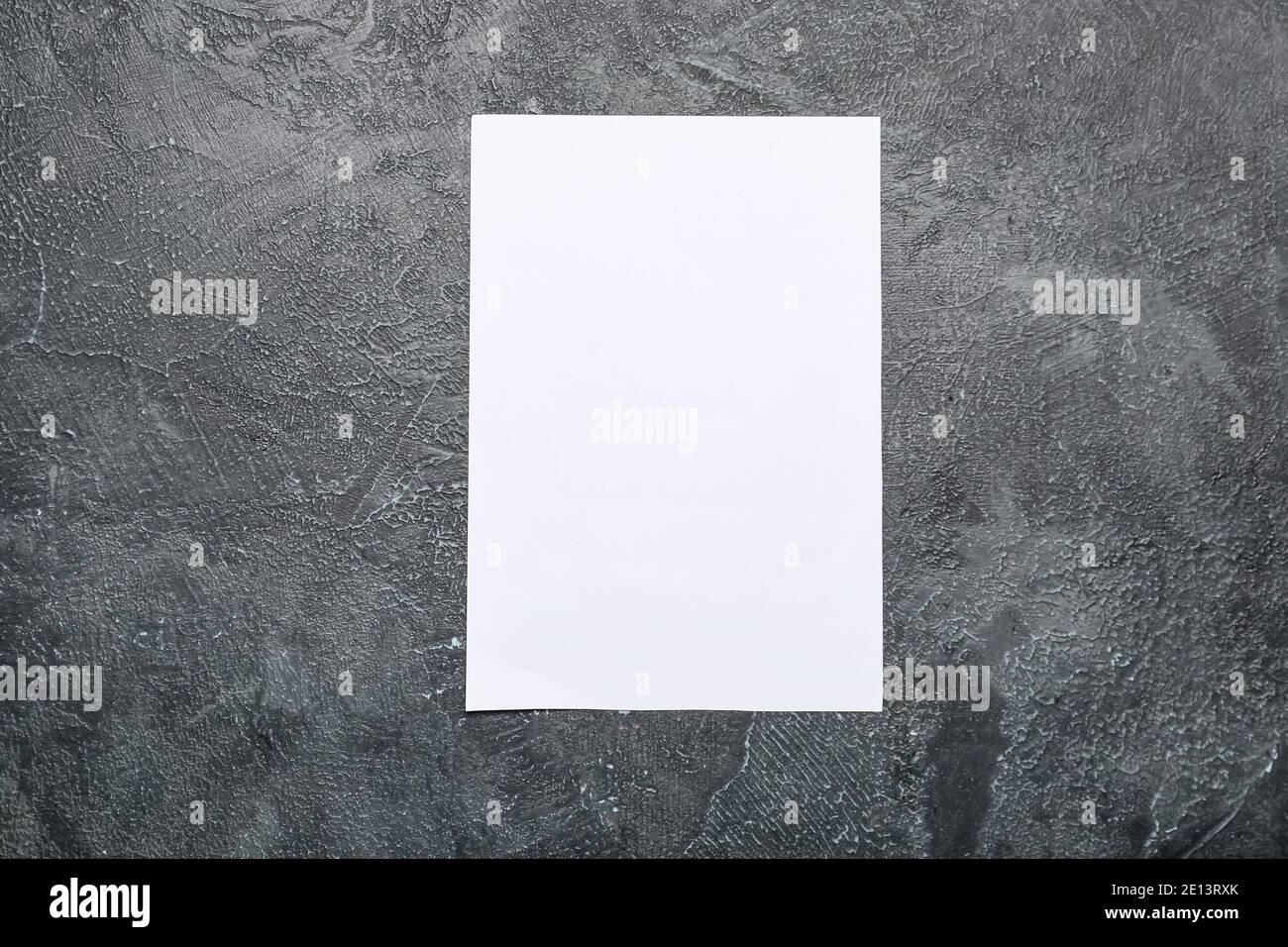 Blank paper sheet on dark background Stock Photo - Alamy