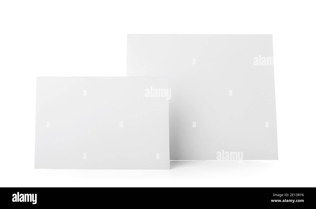 Blank paper sheets on white background Stock Photo - Alamy