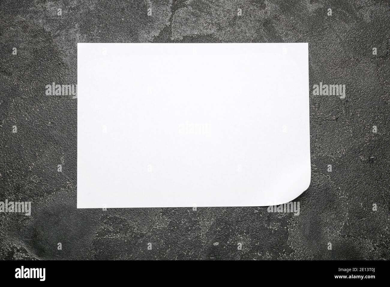 Blank paper sheet on dark background Stock Photo - Alamy