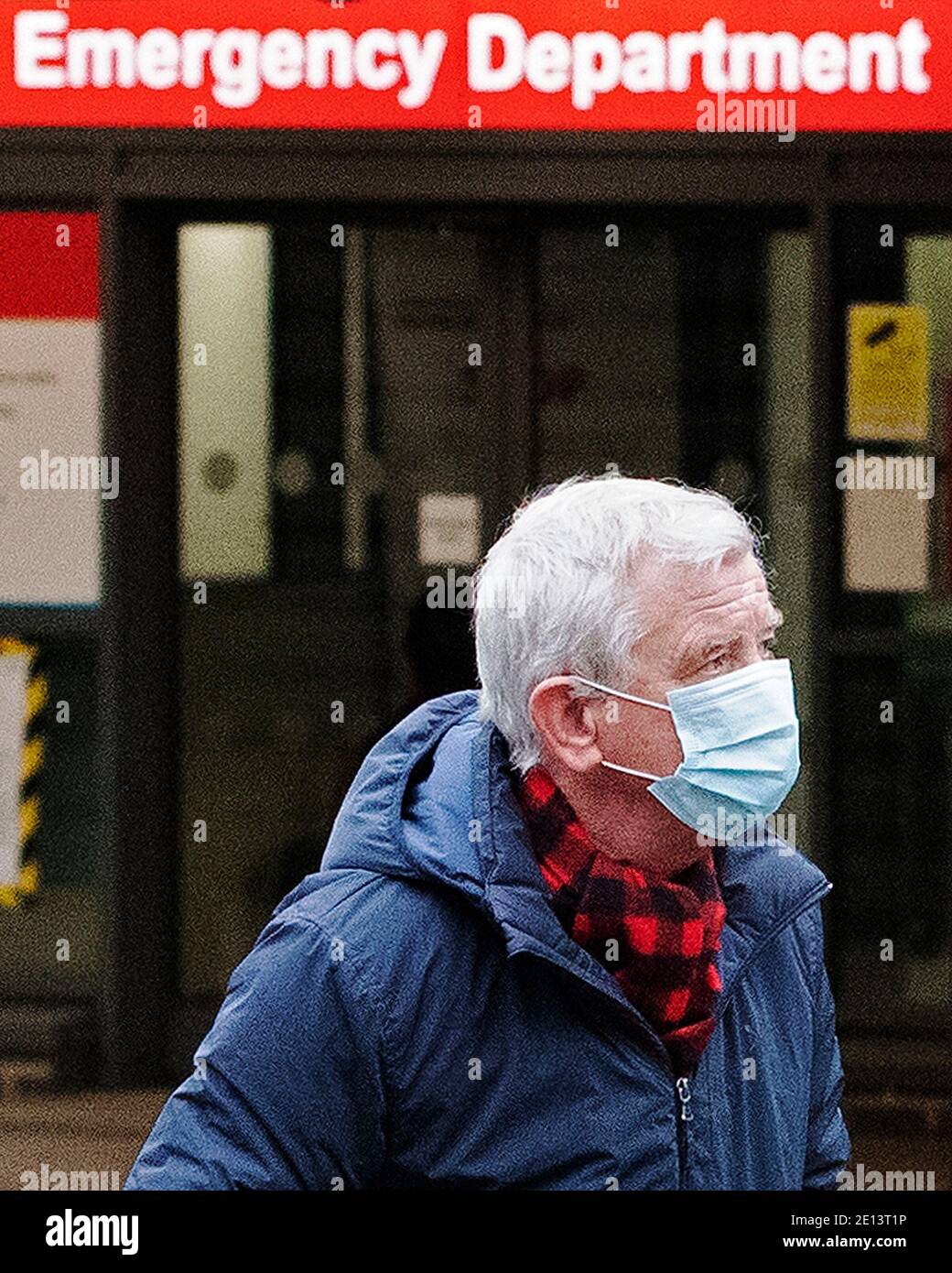 People wearing masks walk past the The Royal Free Hospital in north ...