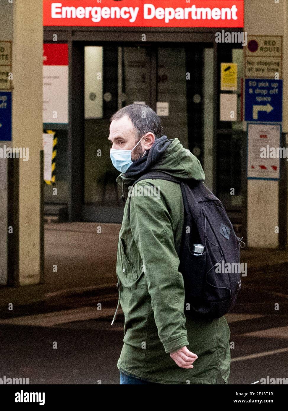 People wearing masks walk past the The Royal Free Hospital in north ...