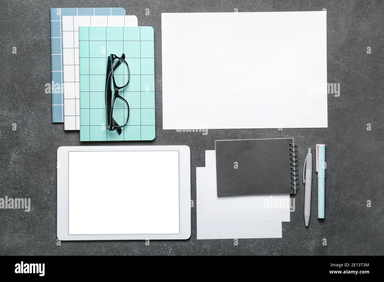 Composition with blank paper sheet, tablet computer and stationary on ...