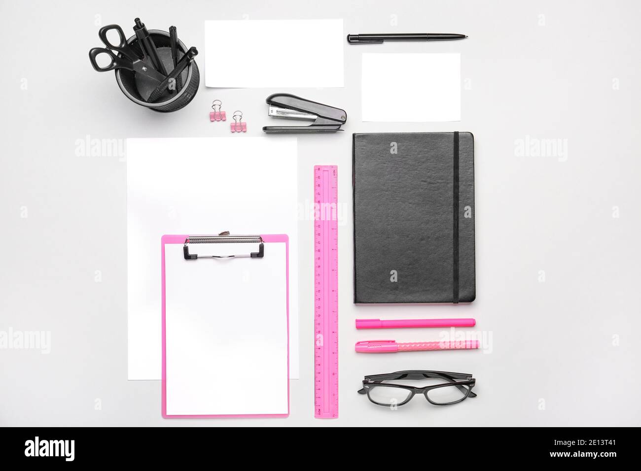 Composition with blank paper sheet and stationary on white background ...