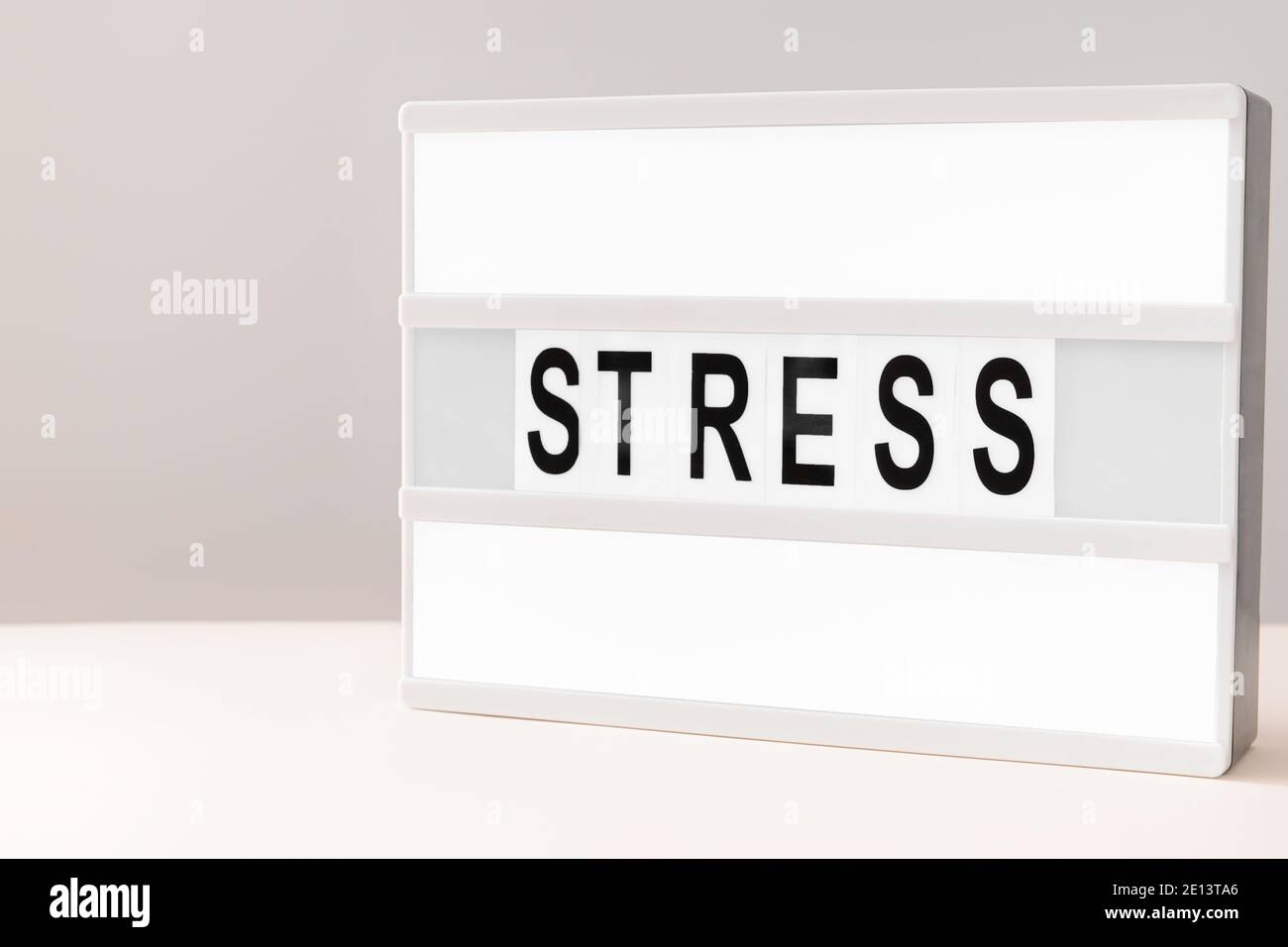 Board with with word STRESS on light background Stock Photo - Alamy