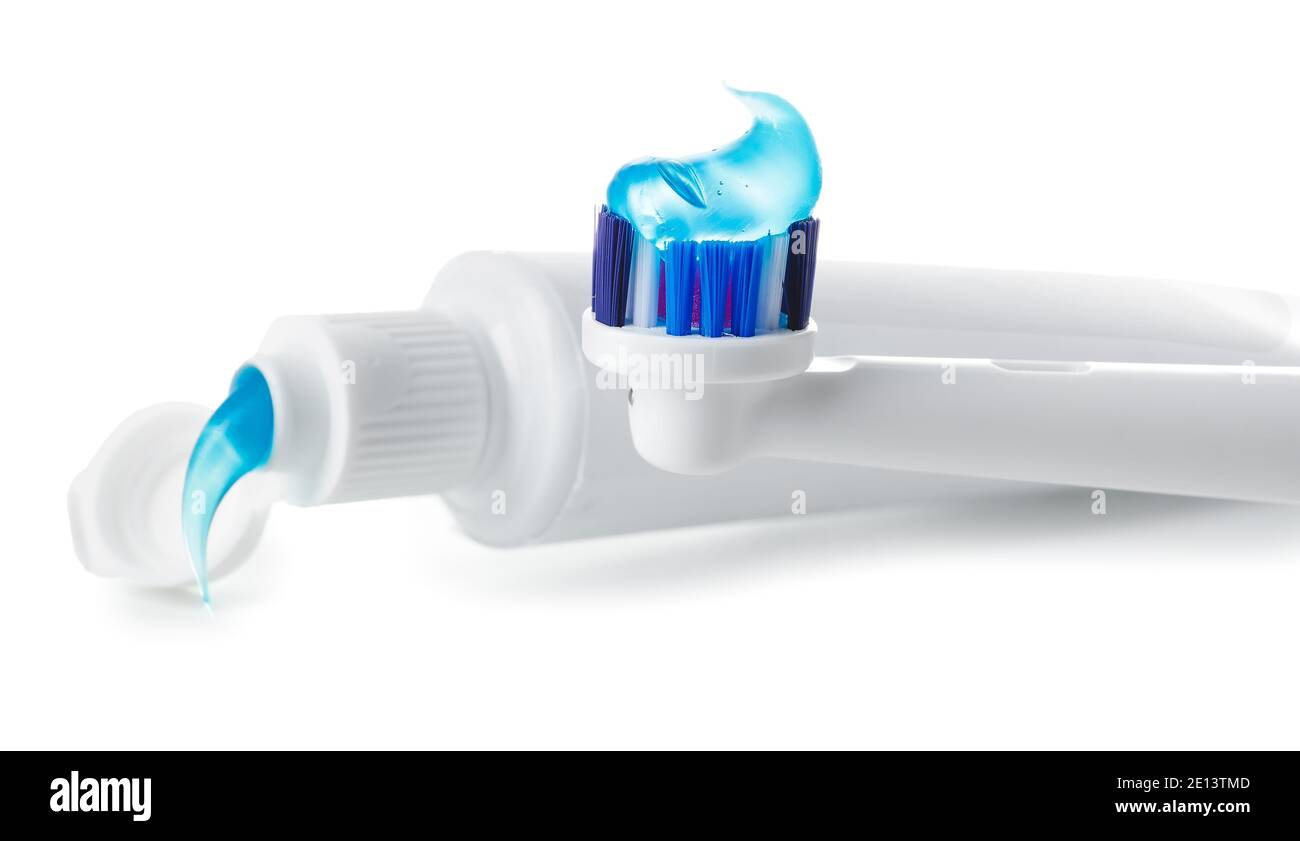 Toothbrush and paste on white background Stock Photo - Alamy