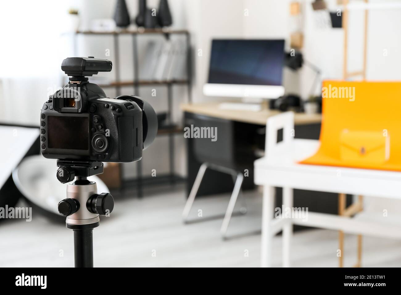 Professional camera on tripod in modern photo studio Stock Photo - Alamy