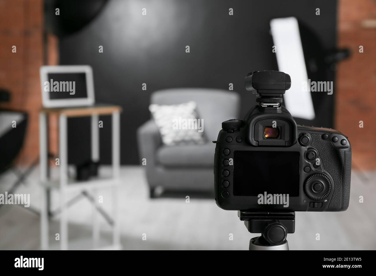 Professional camera on tripod in modern photo studio Stock Photo - Alamy