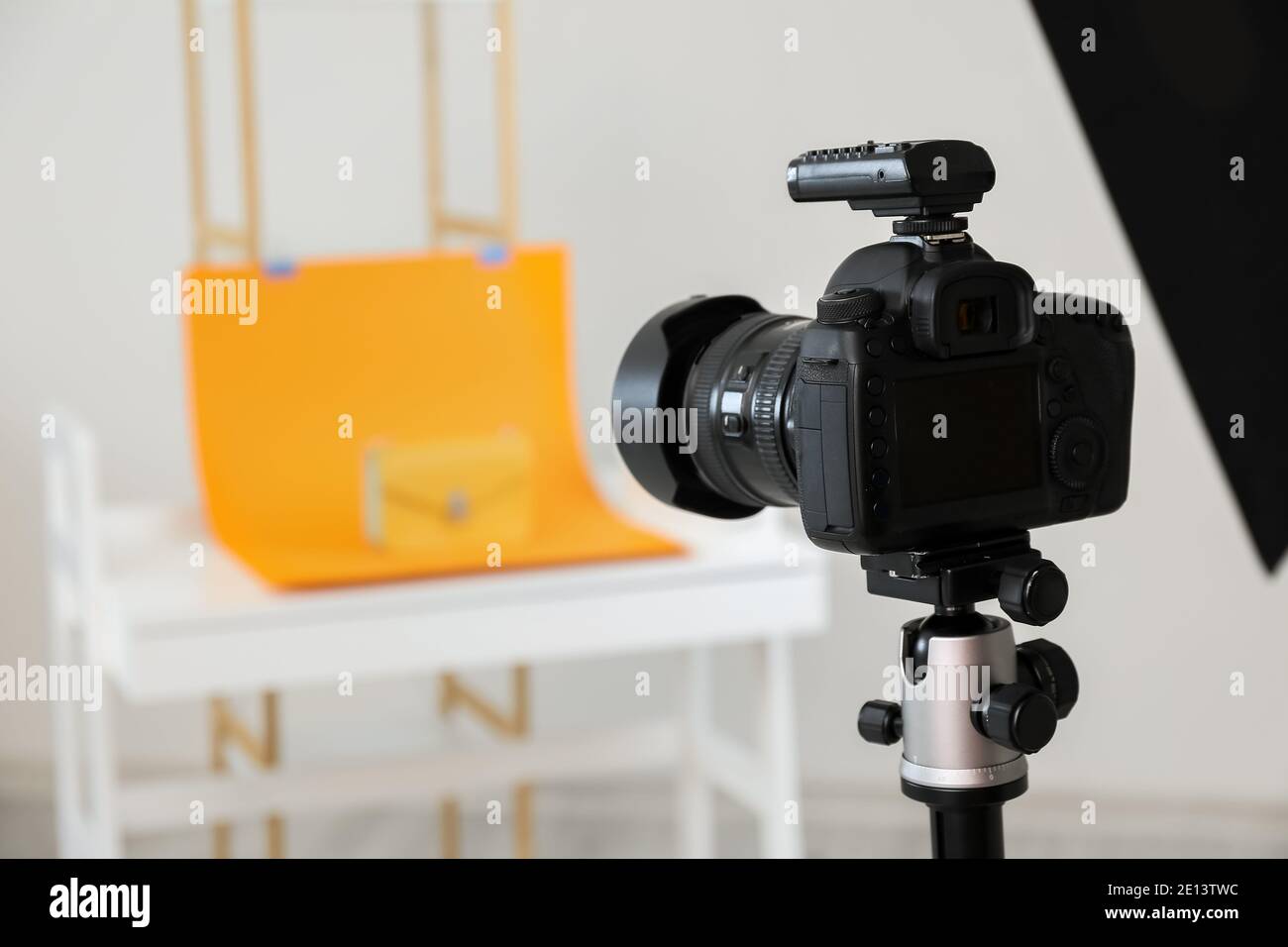 Professional camera on tripod in modern photo studio Stock Photo - Alamy