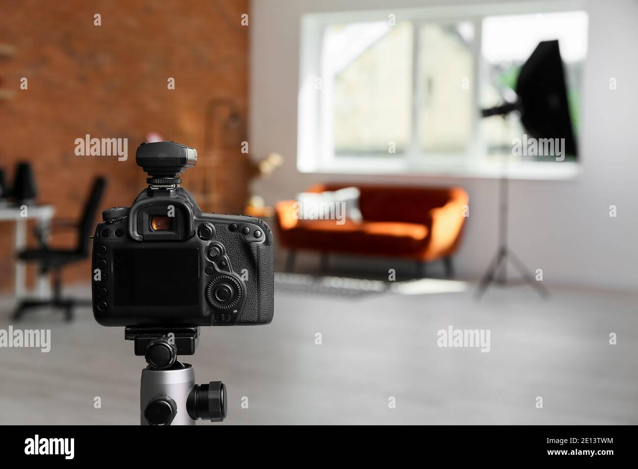 Professional camera on tripod in modern photo studio Stock Photo - Alamy
