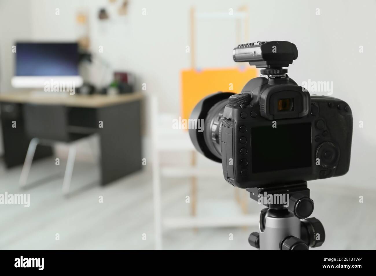 Professional camera on tripod in modern photo studio Stock Photo - Alamy