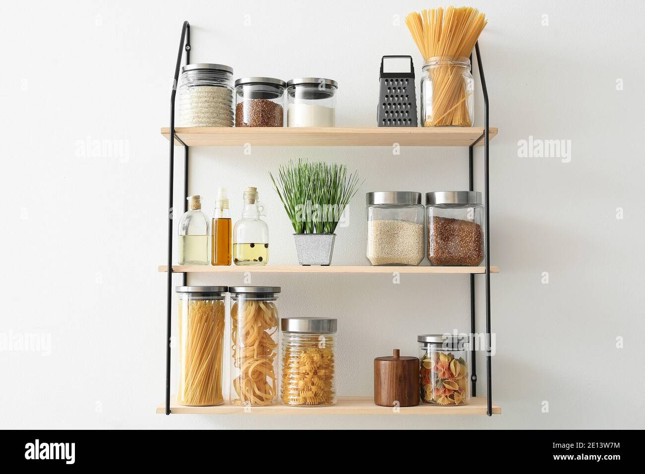 Set of jars with products on kitchen shelves Stock Photo - Alamy