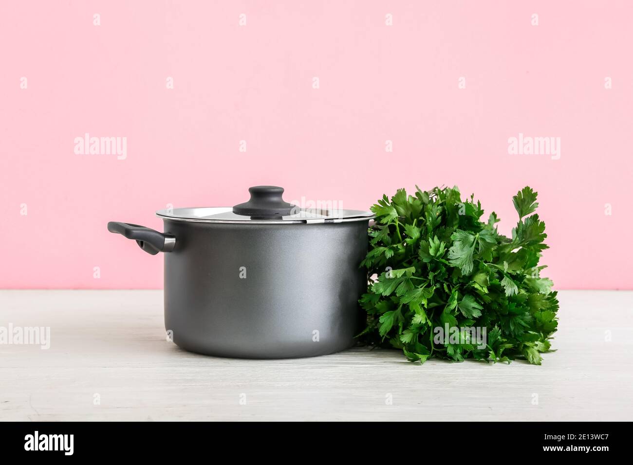 Cooking pot on color background Stock Photo - Alamy
