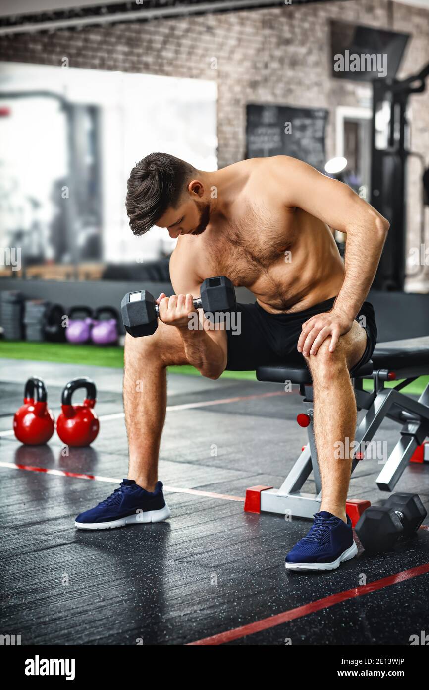 Muscular man training hard kettlebell hi-res stock photography and ...