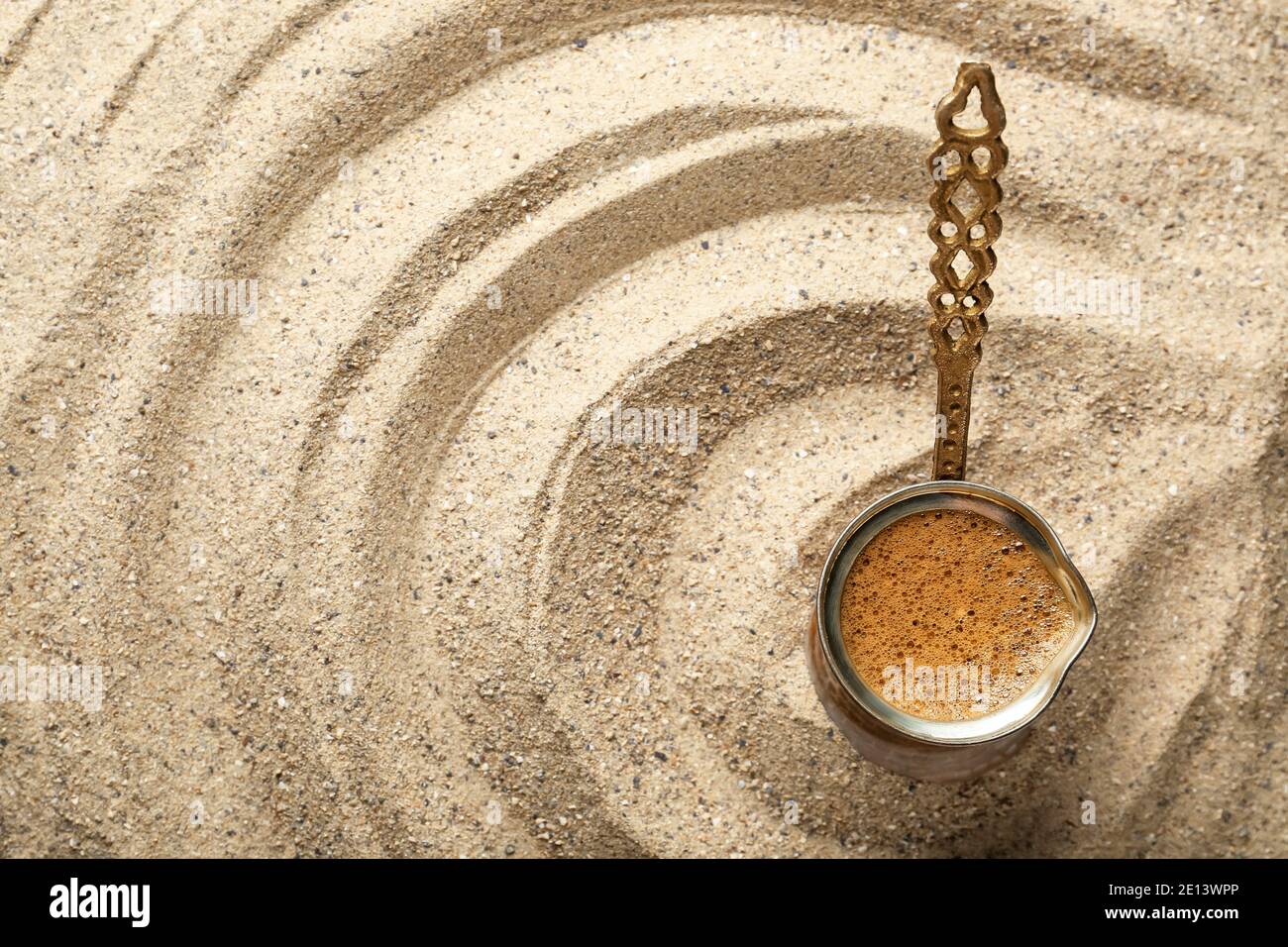 Turkish coffee cooked in sand, closeup Stock Photo - Alamy
