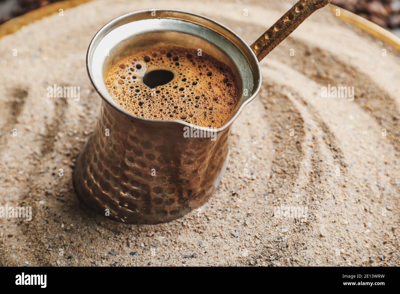 Turkish coffee cooked in sand, closeup Stock Photo - Alamy